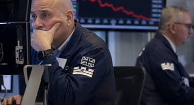 UK shares slip as earnings weigh ahead of central bank decisions